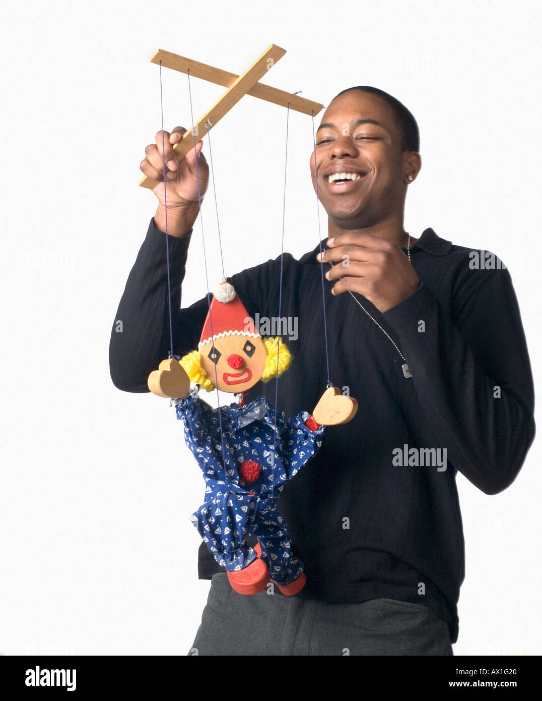 Portrait African American man playing with puppet Stock Photo - Alamy