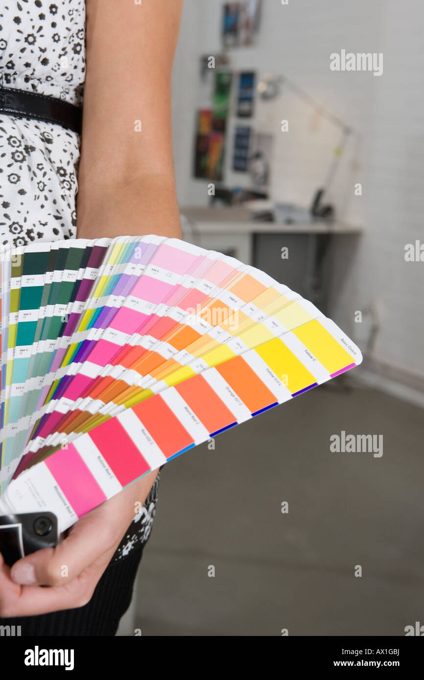 A woman holding a color swatch Stock Photo - Alamy
