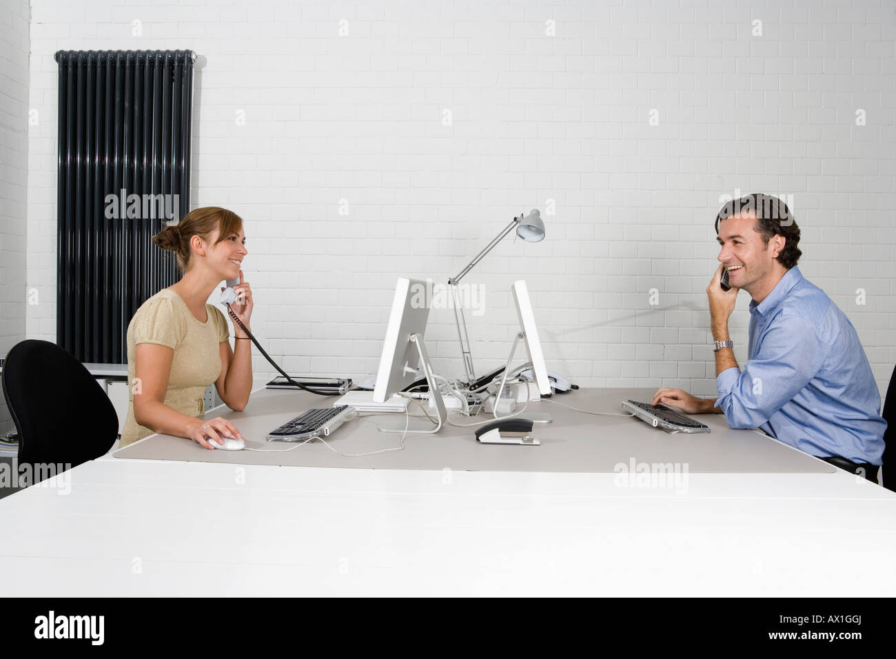 Two women sitting opposite each other hi-res stock photography and ...