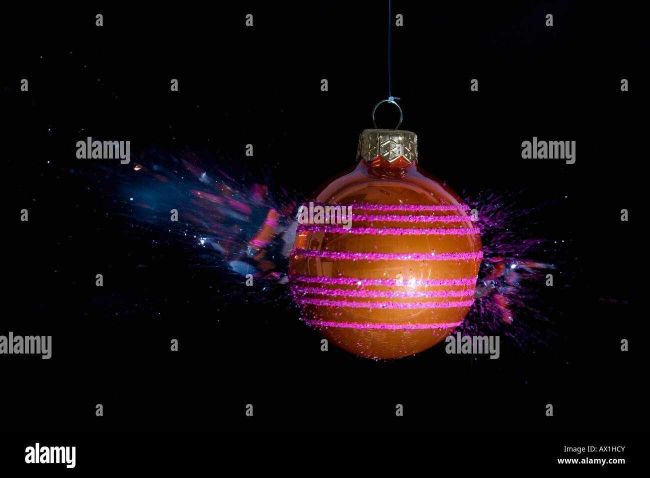 An exploding Christmas bauble Stock Photo - Alamy