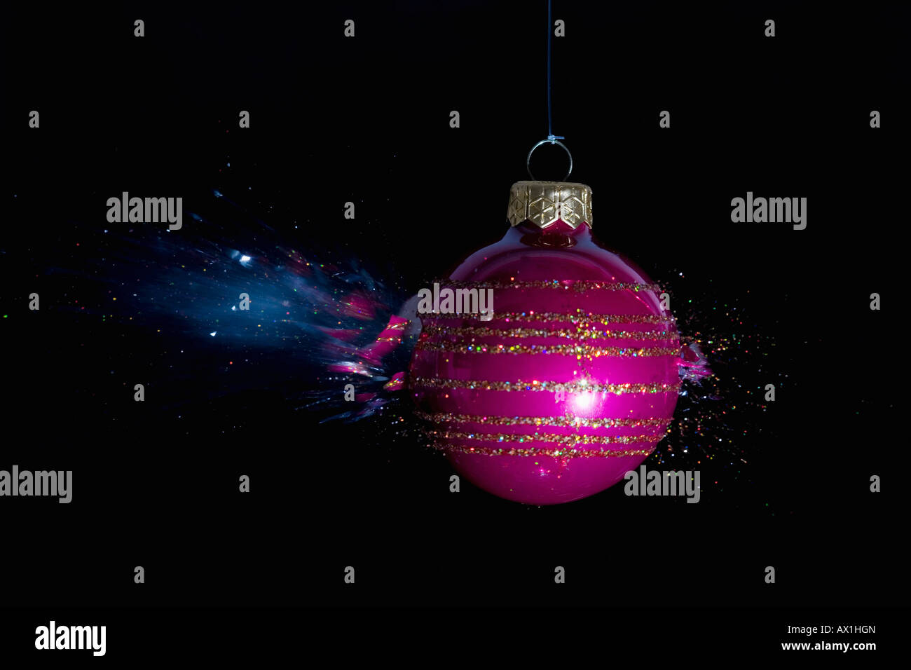 An exploding Christmas bauble Stock Photo - Alamy