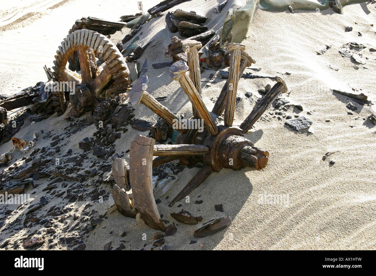 Old broken wooden wheel in sand, diamond prohibited area, Saddlehill ...