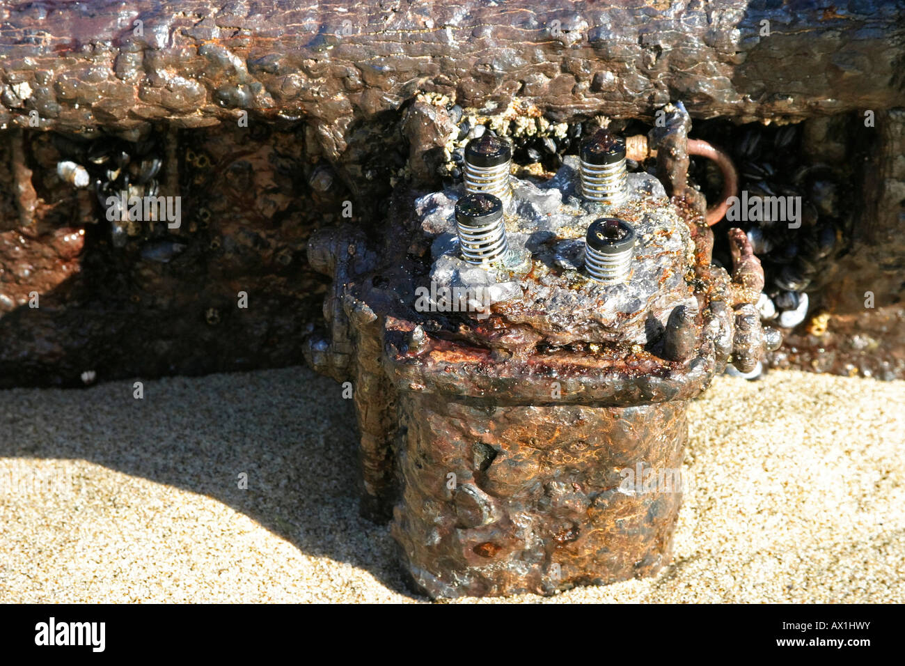 Old strong rusted engine parts in sand, diamond prohibited area ...