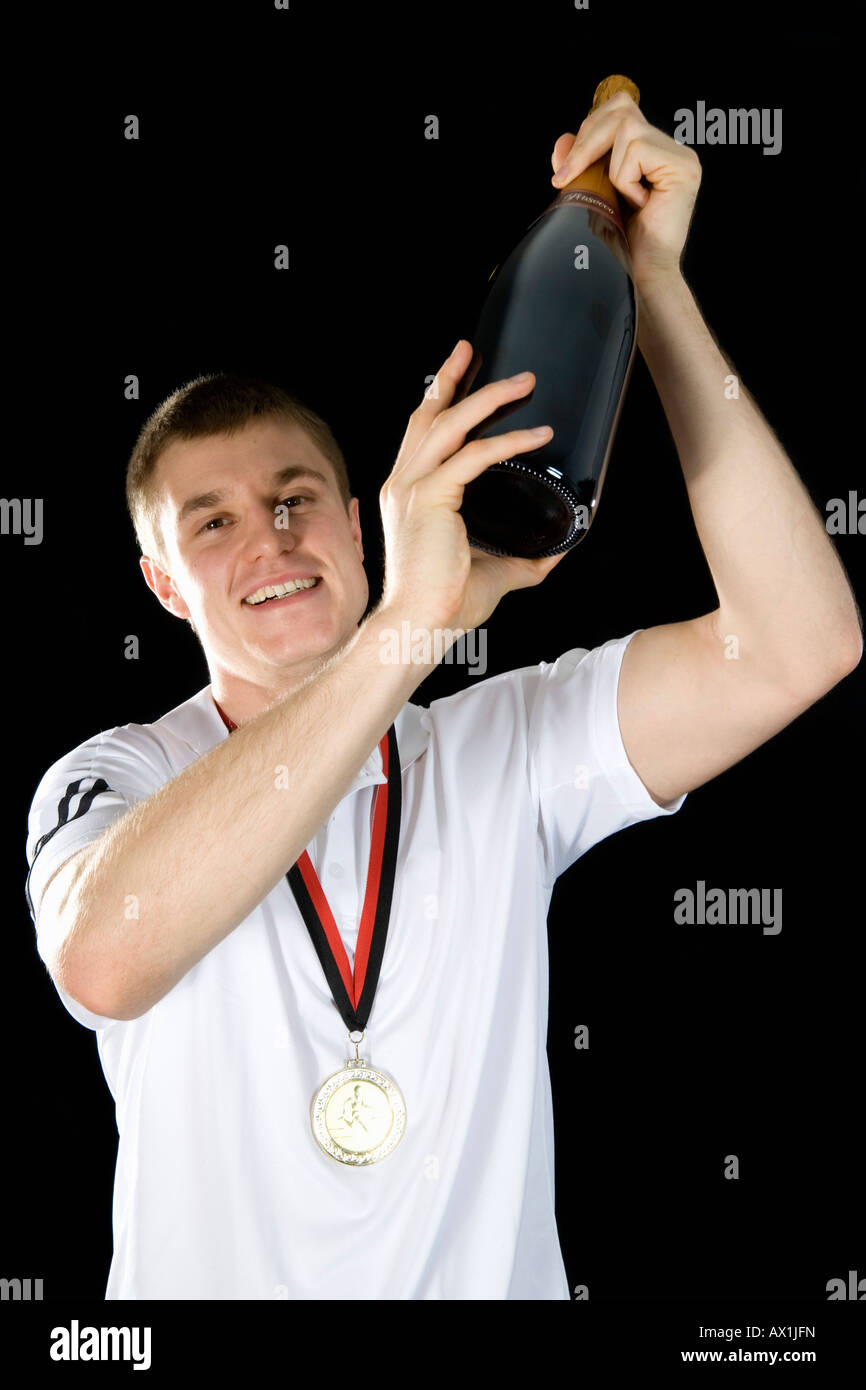 A sportsperson celebrating with champagne Stock Photo - Alamy