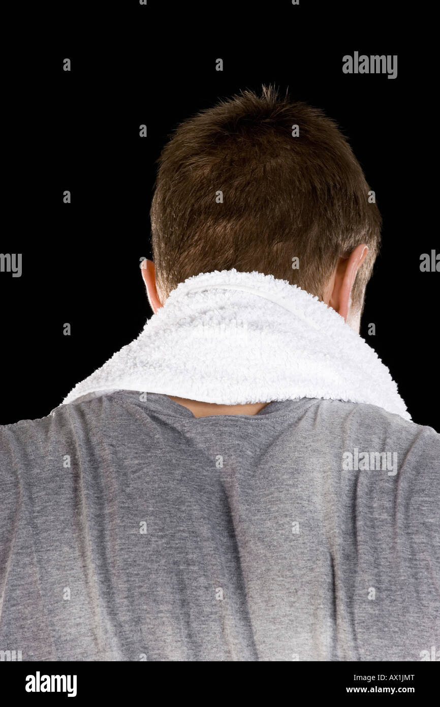 A man with a towel around his neck Stock Photo - Alamy