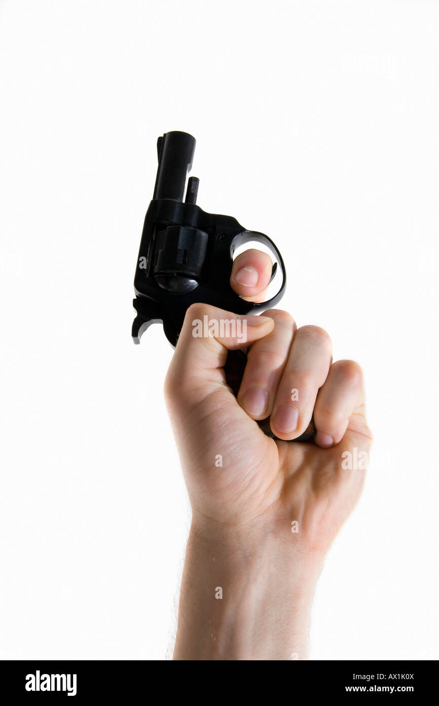 Studio shot of a human hand holding a starting gun Stock Photo - Alamy