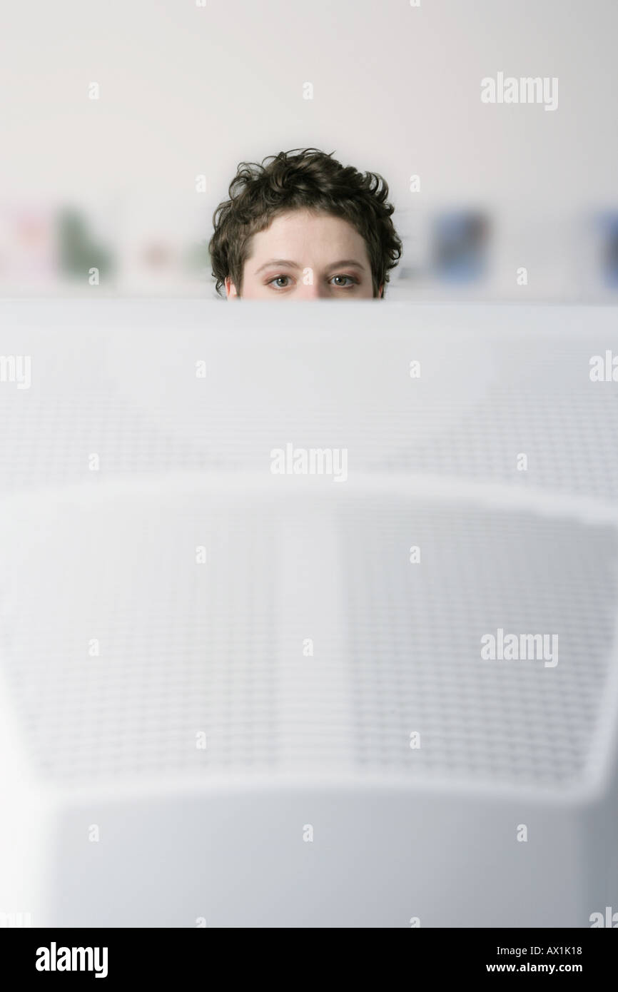 Woman staring at computer monitor Stock Photo - Alamy