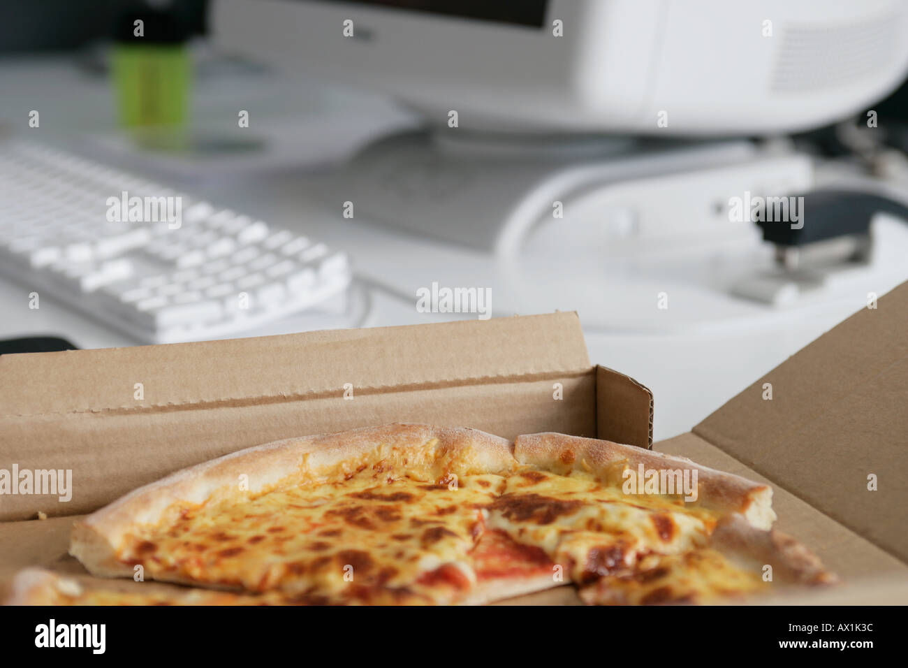 Pizza box on office desk Stock Photo - Alamy