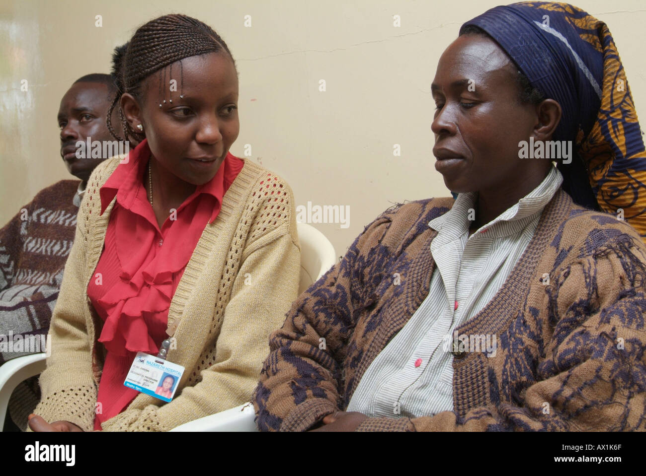 Doctor Aids patient Stock Photo - Alamy