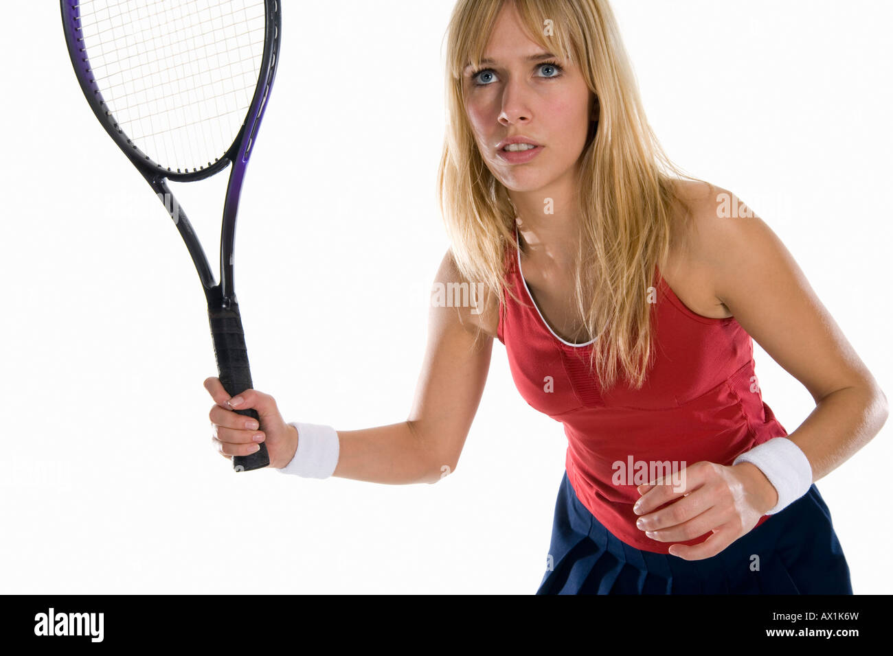 Studio portrait of a female tennis player holding a tennis racket Stock ...