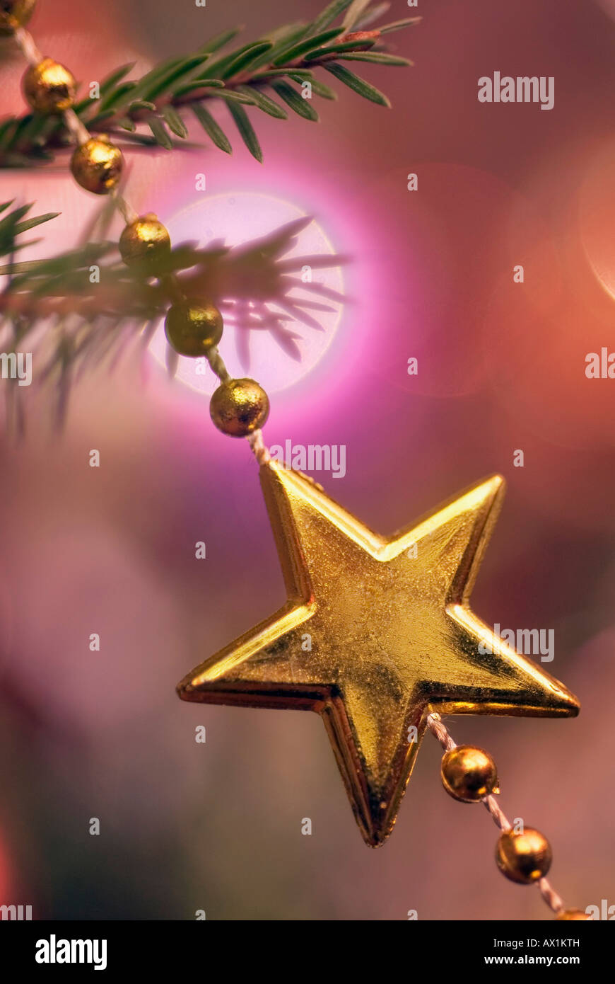 A star hanging on a Christmas tree Stock Photo - Alamy