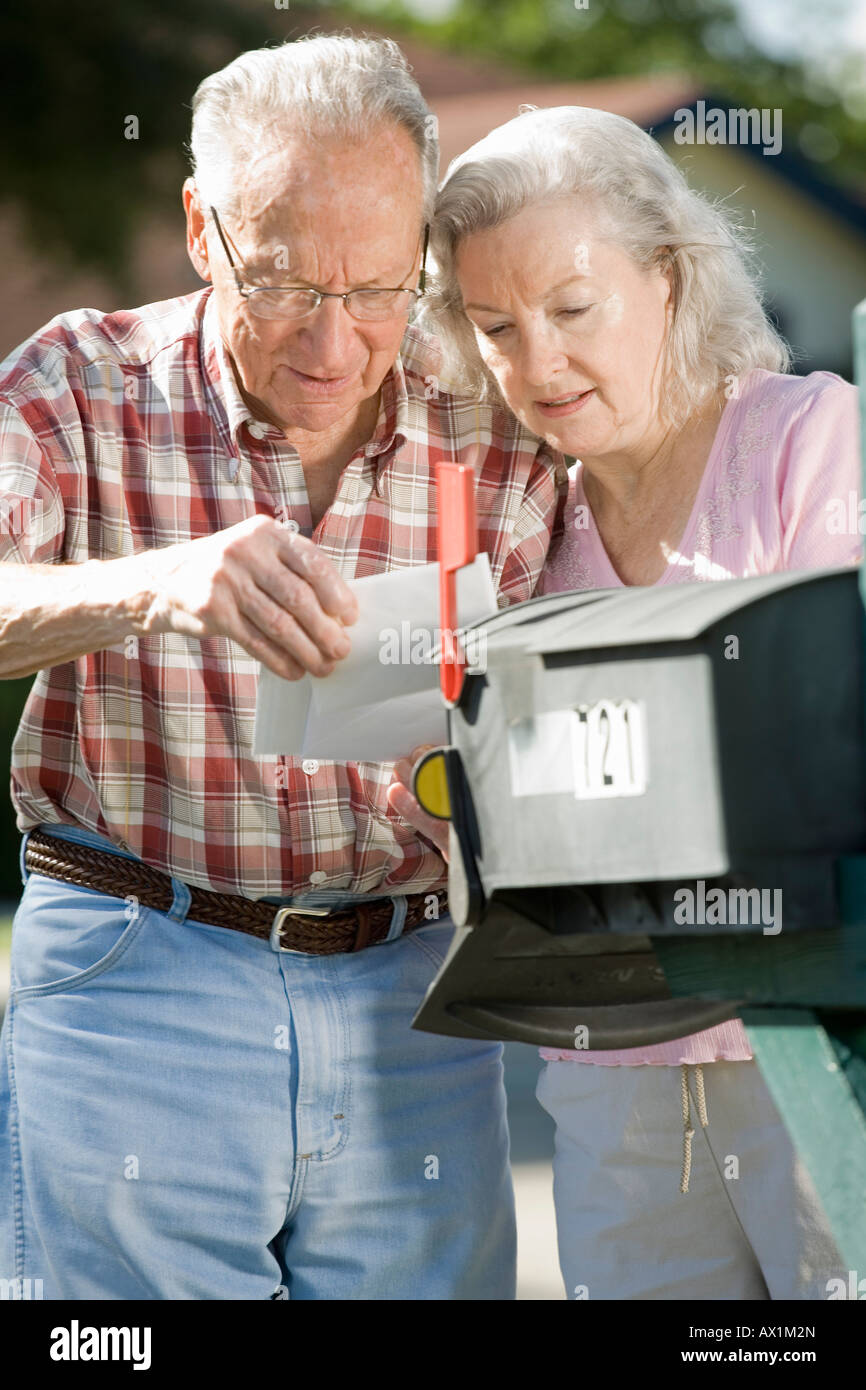 A senior couple checking the mailbox Stock Photo - Alamy