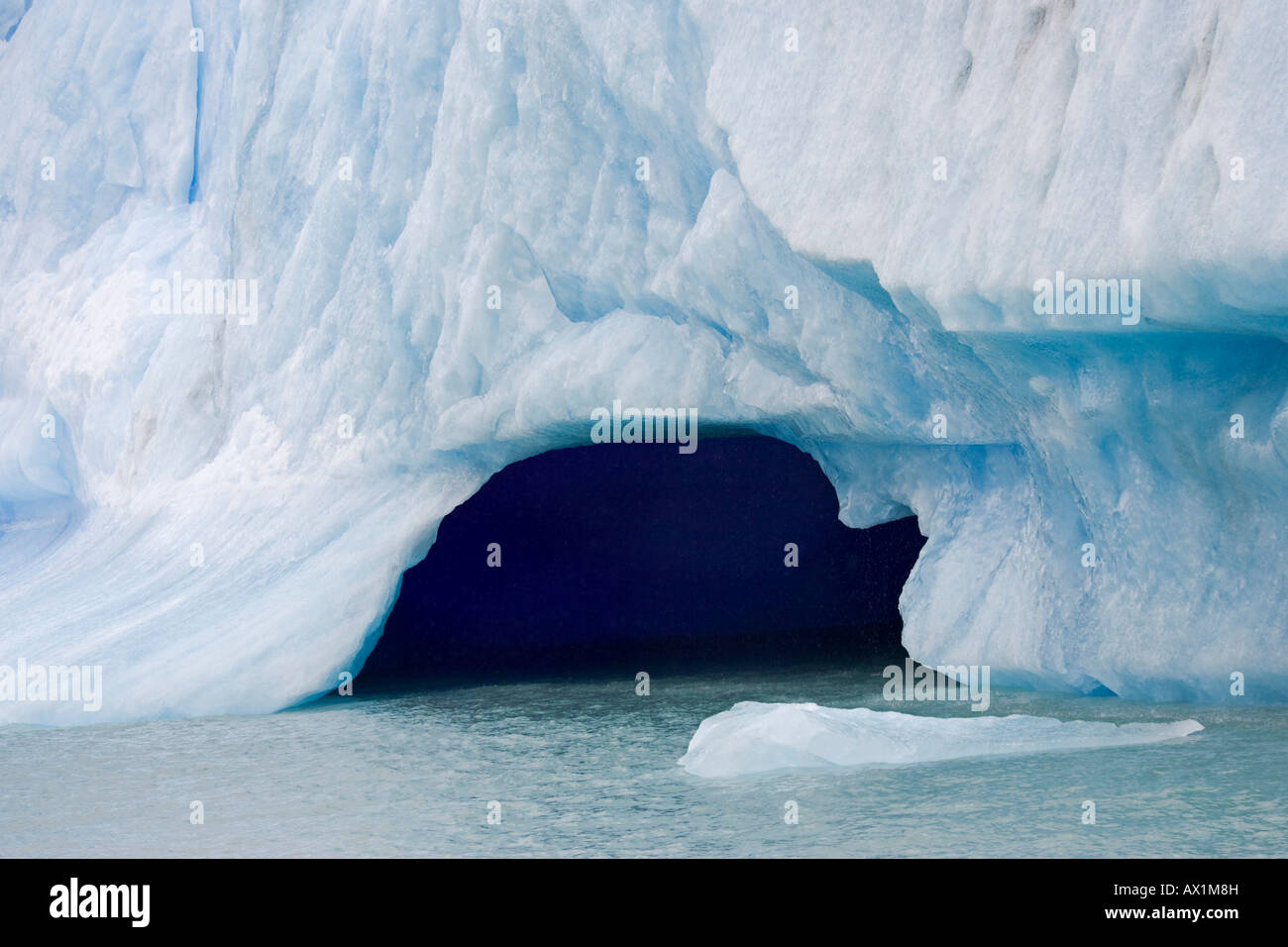 Iceberg detail with a cave in the lake Lago Argentino, national park ...