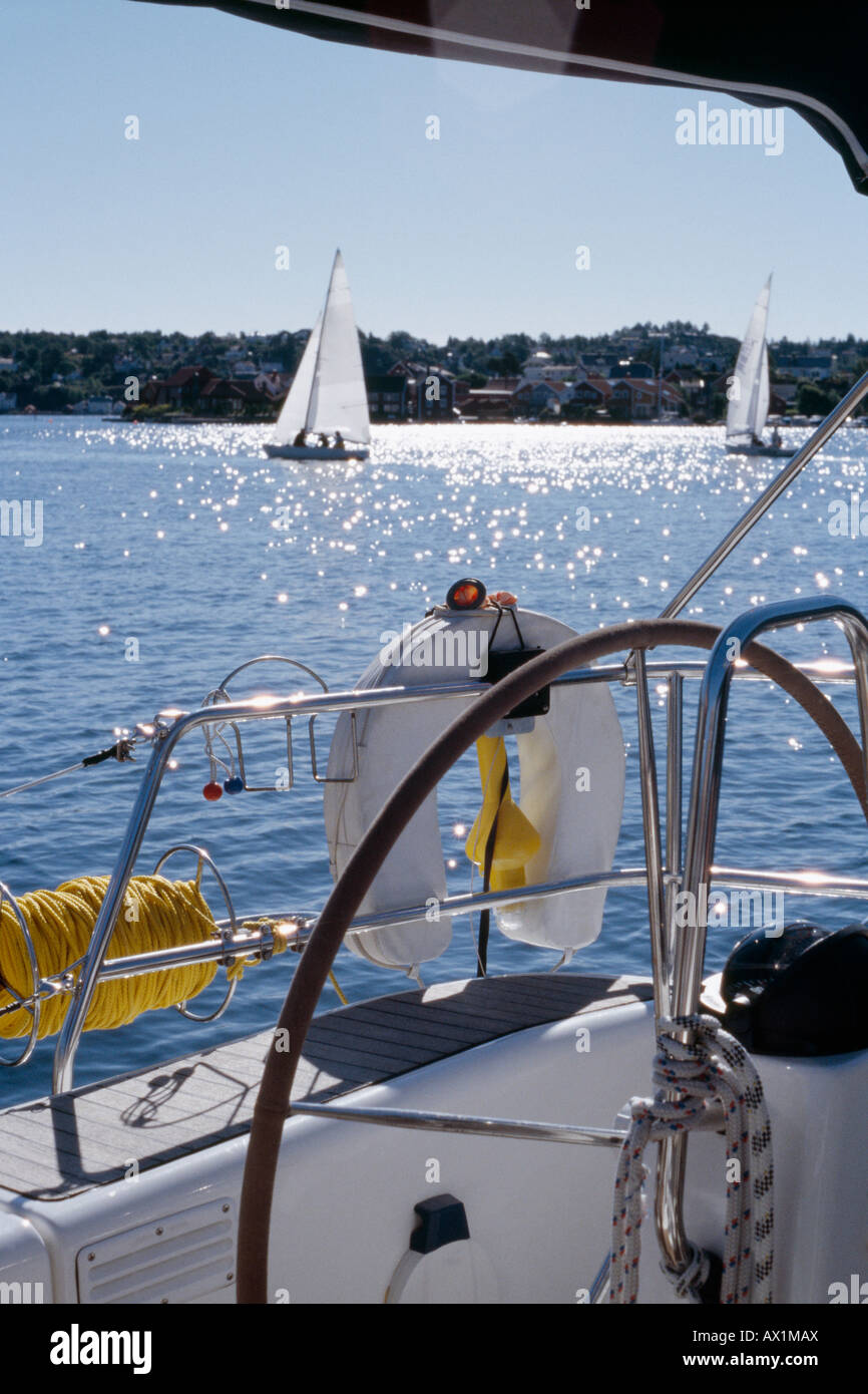 Boats sailing on a lake Stock Photo - Alamy