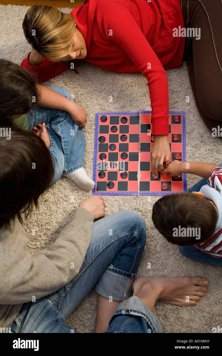 A family playing chess together Stock Photo - Alamy