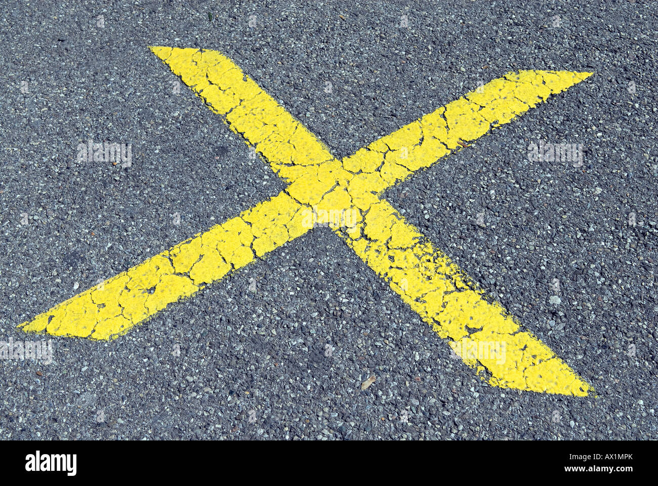 yellow cross on tarmac road, geneva, switzerland Stock Photo - Alamy