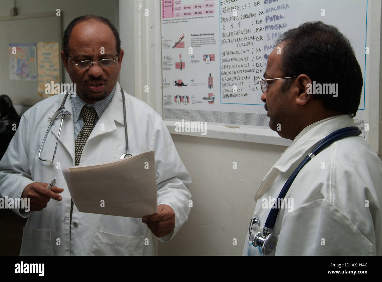 Two doctors talking in a corridor of an African hospital Stock Photo ...