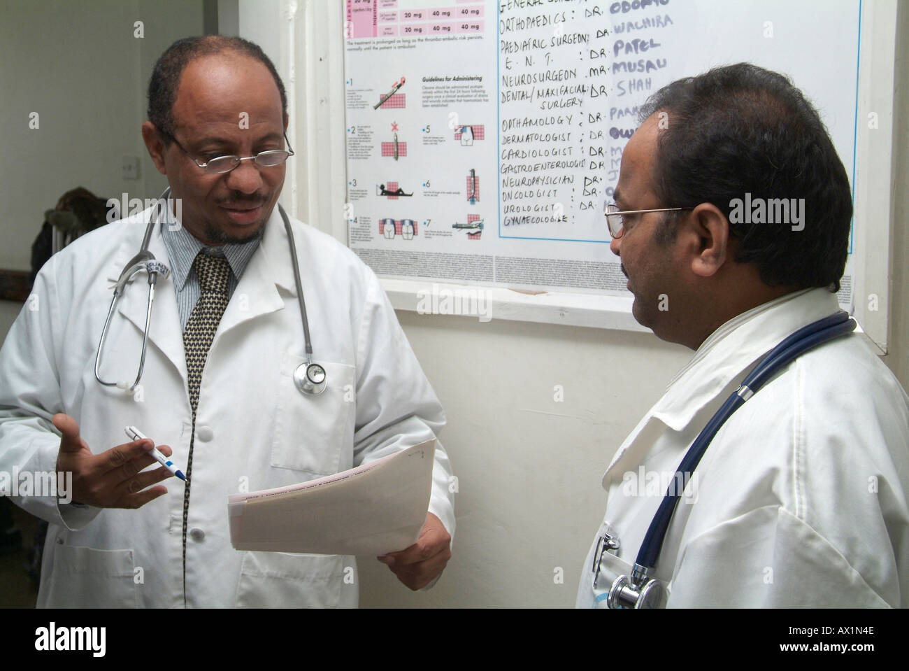 Two doctors talking in a corridor of an African hospital Stock Photo ...