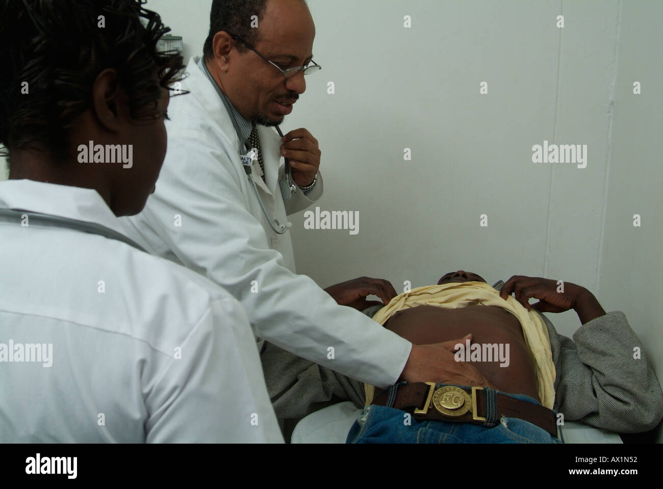 African doctor patient touch hi-res stock photography and images - Alamy