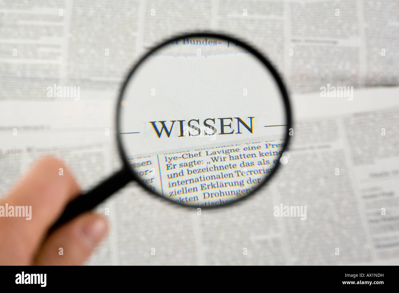 Reading newspaper magnifying glass hi-res stock photography and images ...