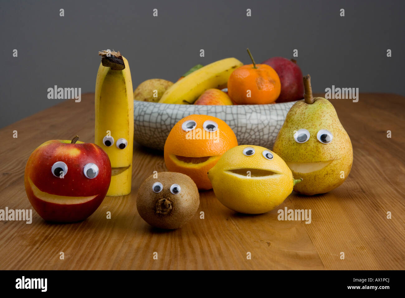 Smiley faces on fruit Stock Photo - Alamy