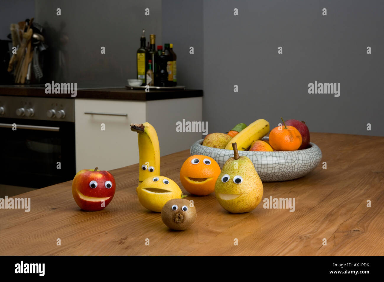 Fruit with smiley faces on a kitchen table Stock Photo - Alamy