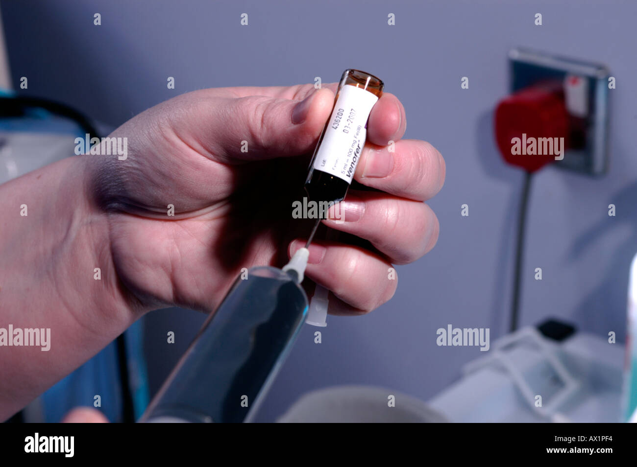 Staff sister drawing up IV Iron Sucrose drug Stock Photo - Alamy