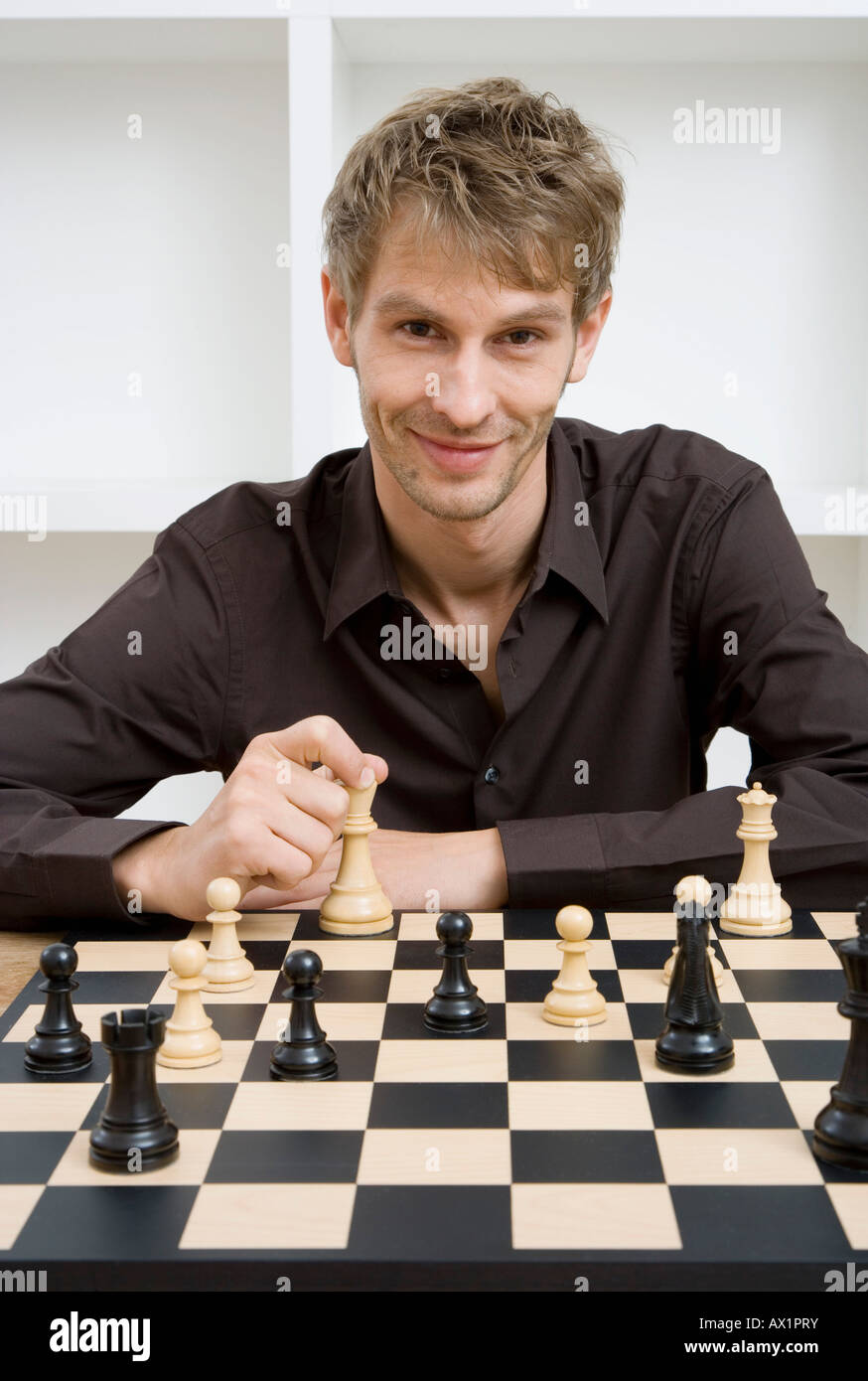 A man playing chess Stock Photo - Alamy