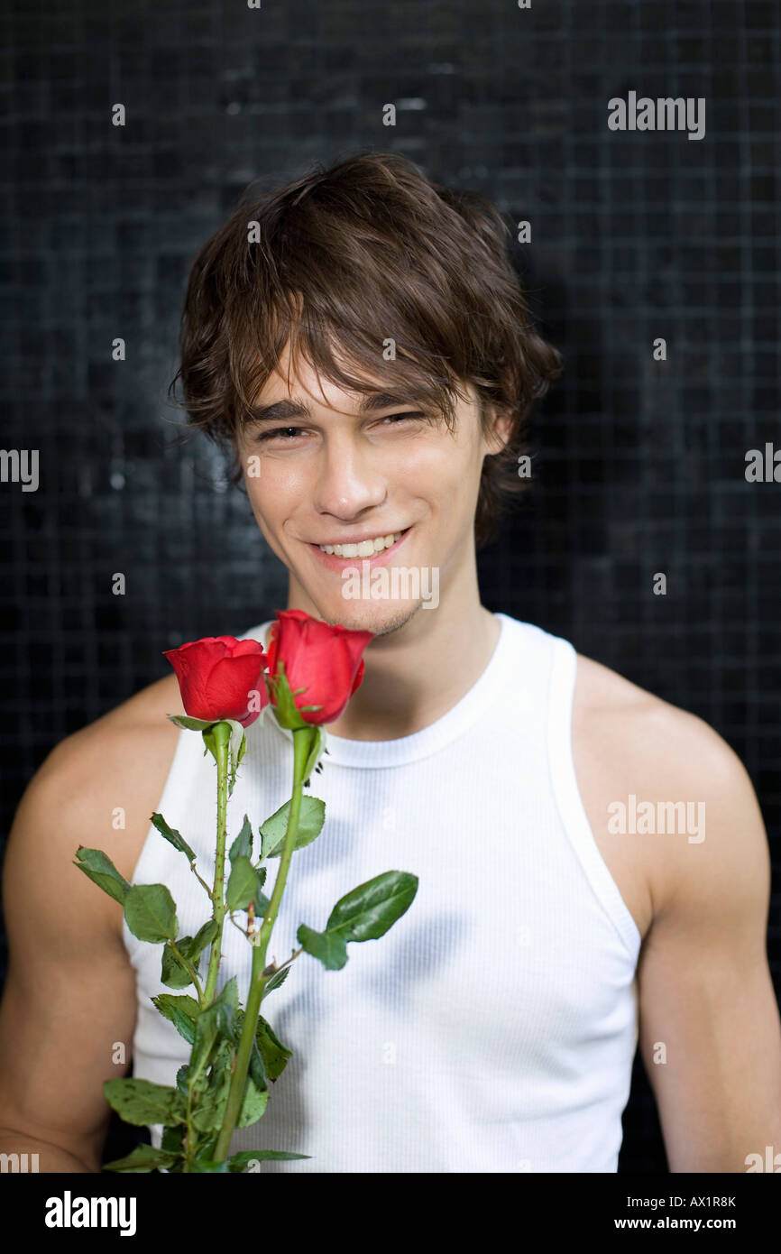 Holding two red roses hi-res stock photography and images - Alamy