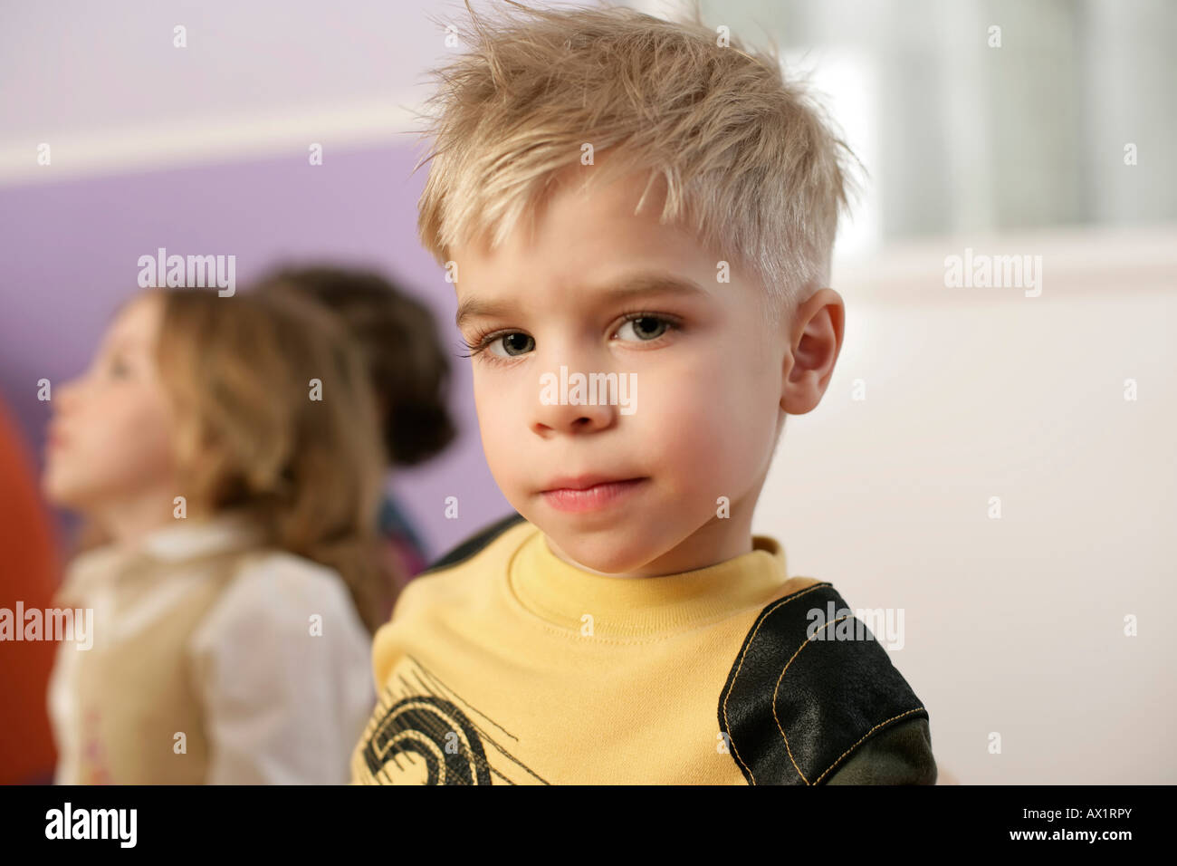 Little boy looking provocative, looking at camera Stock Photo - Alamy