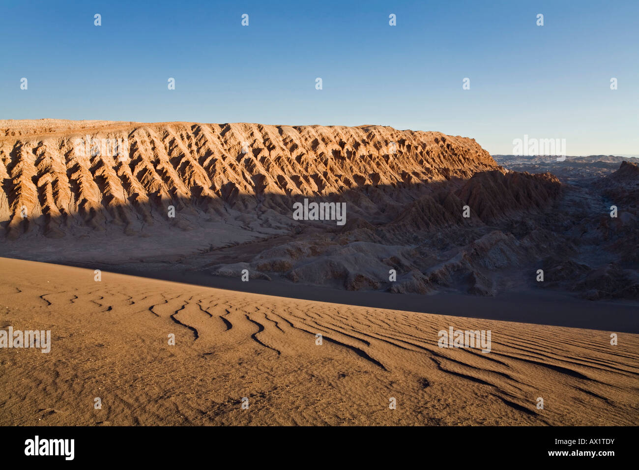 On the big sand dune at Valle de la Luna, sunset, Chile, South America ...
