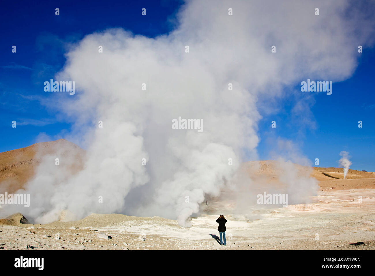 Geyser field Sol de Manana with aphotographer, Altiplano, Bolivia ...