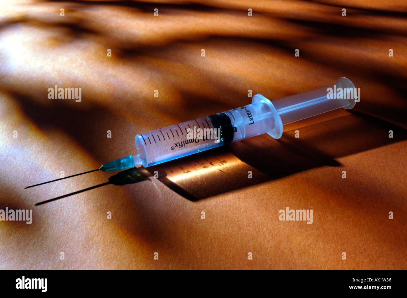 Syringe with lighting effect Stock Photo - Alamy