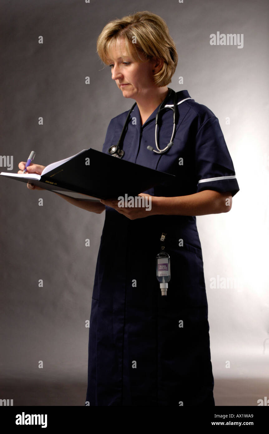 Nurse writing notes Stock Photo - Alamy
