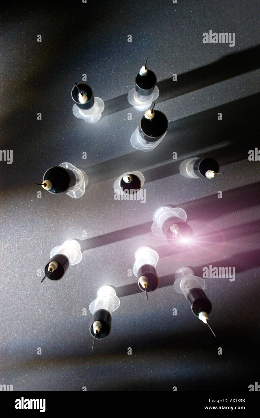 Multiple syringes with coloured background Stock Photo - Alamy