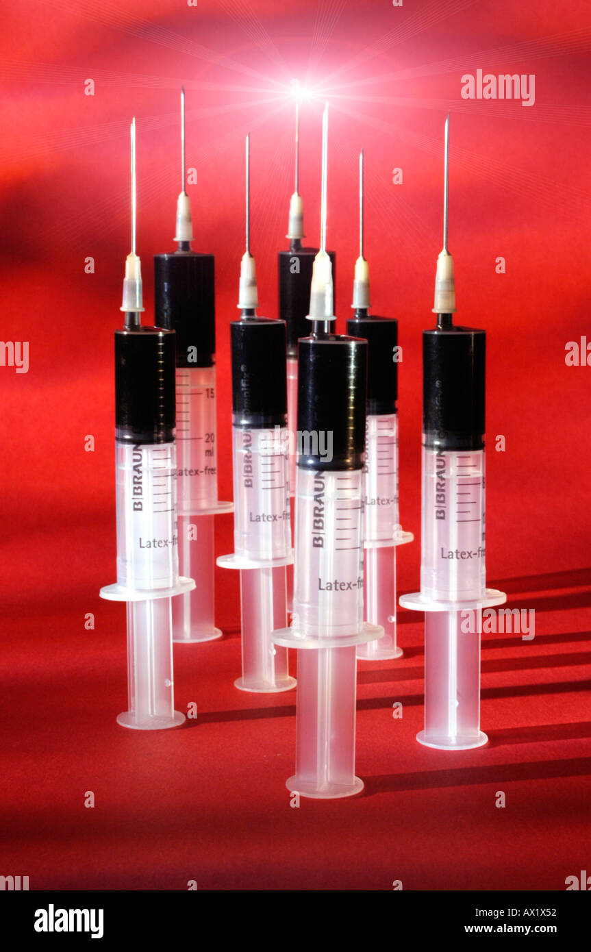 Multiple syringes with coloured background Stock Photo - Alamy