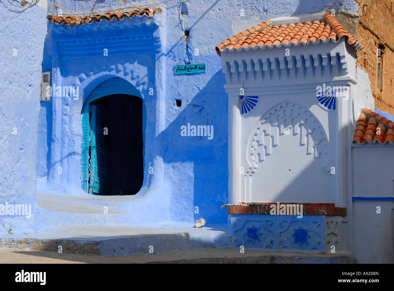 Luminous blue gate near fountain medina Chefchaouen Morocco Stock Photo ...