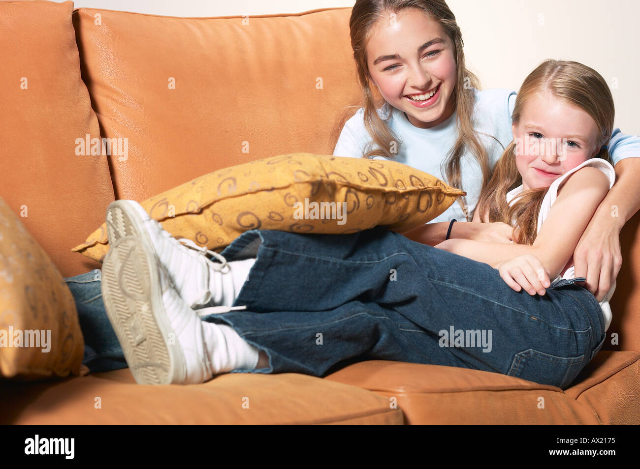 Children sitting on chair BE 2 Stock Photo - Alamy