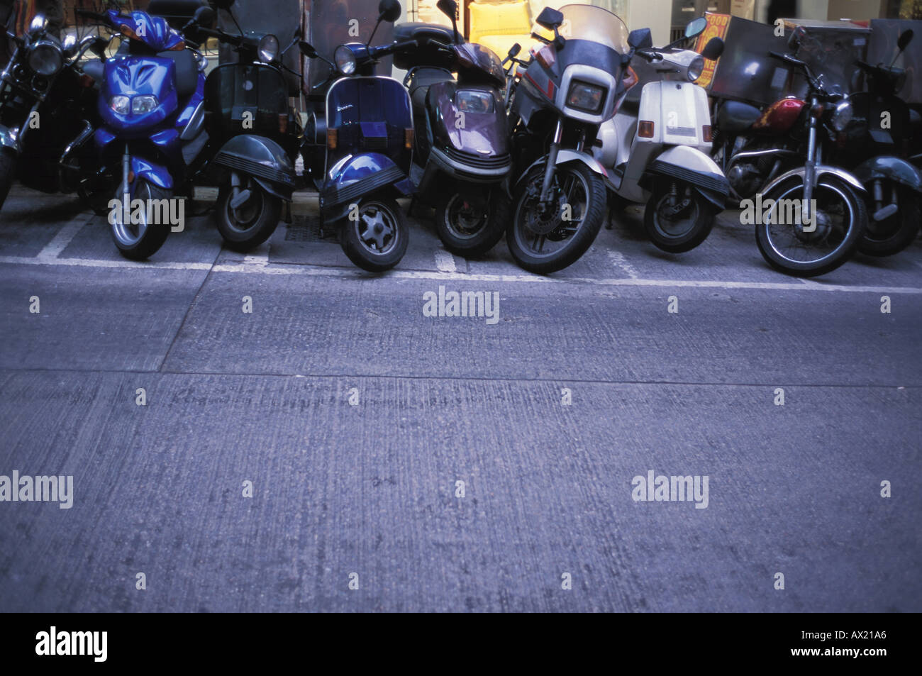 Motorcycles parked on sidewalk Stock Photo - Alamy