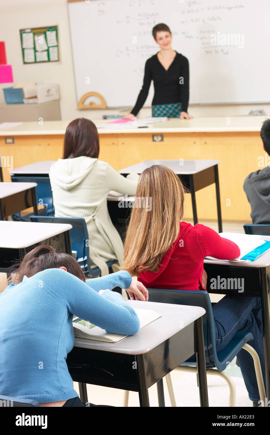 Teacher in classroom full of students a85 Stock Photo - Alamy