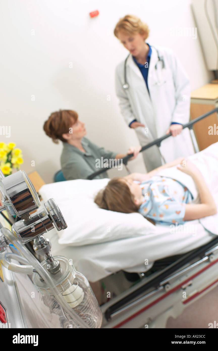 Patient in hospital bed an 1 Stock Photo - Alamy