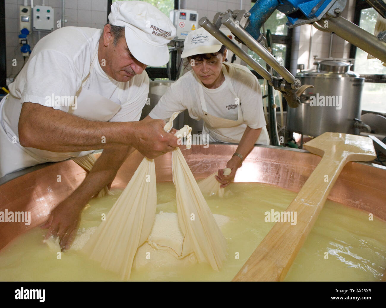 Making organic Parmesan Cheese Removing the cheese from the mix Italy ...