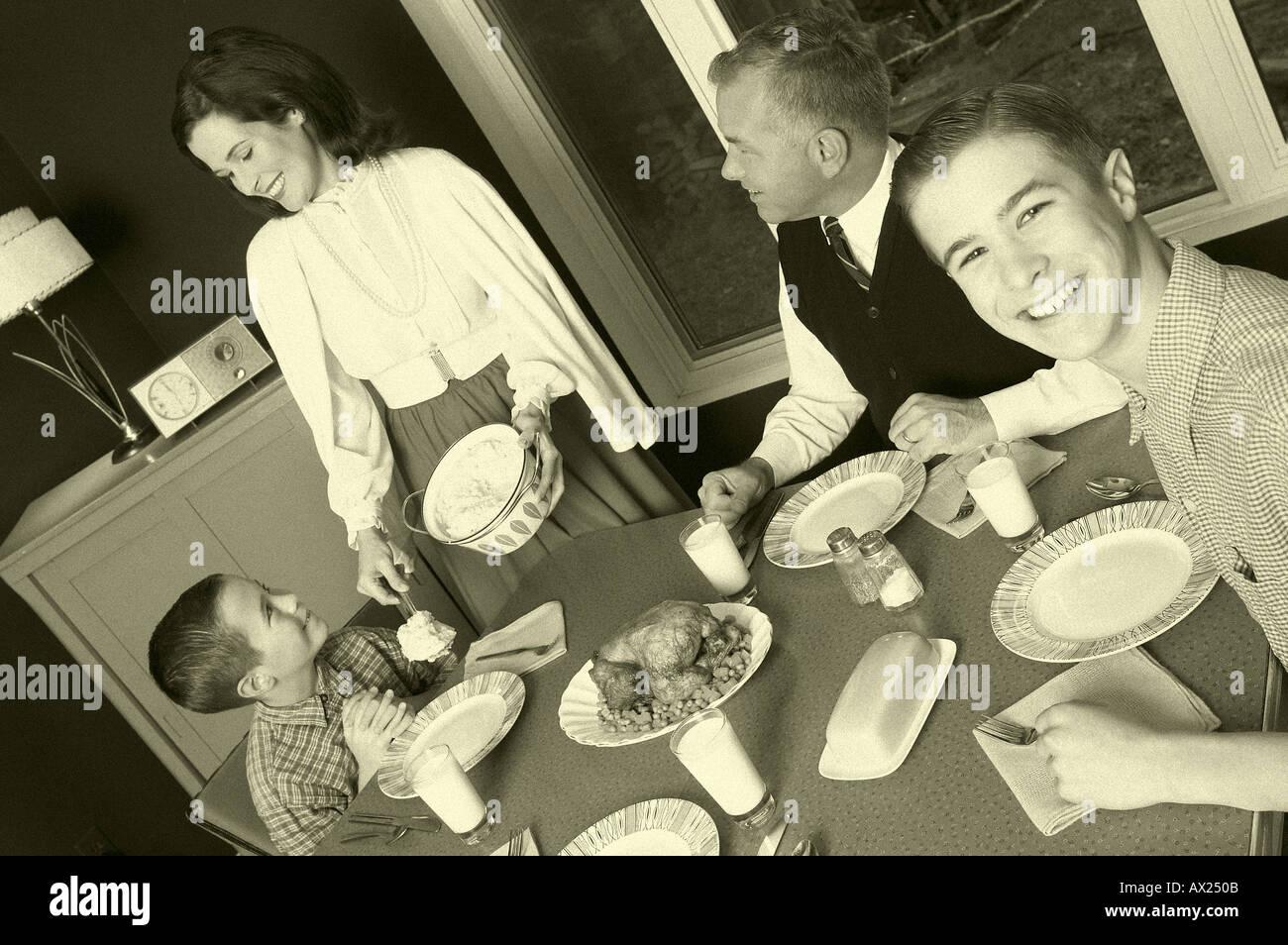 1950s family at dinner table uid 1426519 Stock Photo - Alamy
