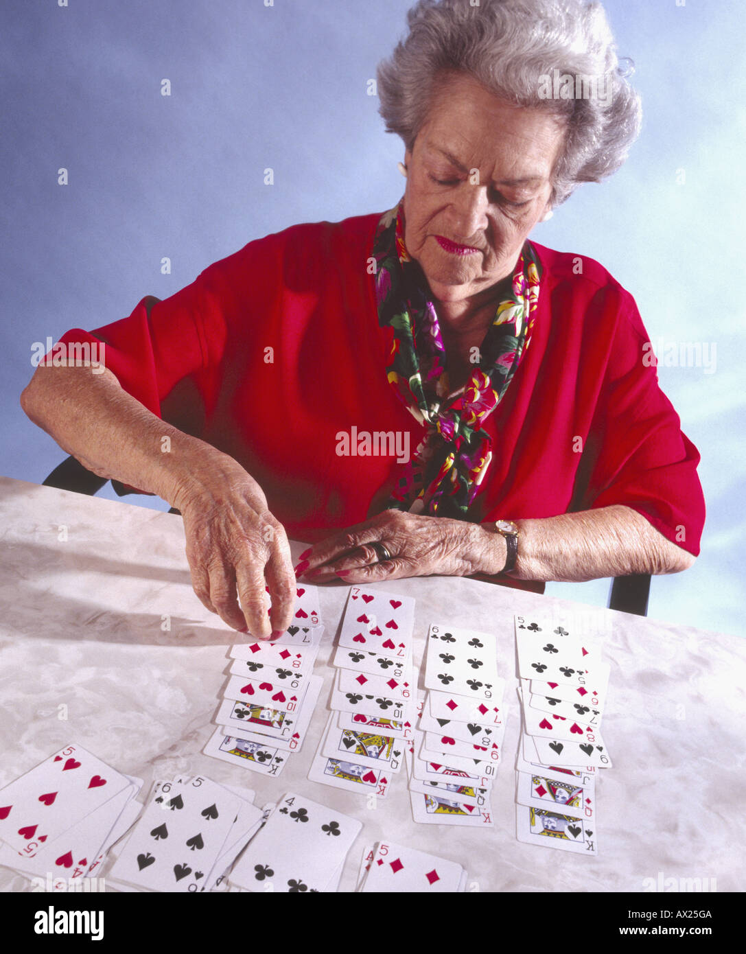 Elderly woman playing solitaire hi-res stock photography and images - Alamy
