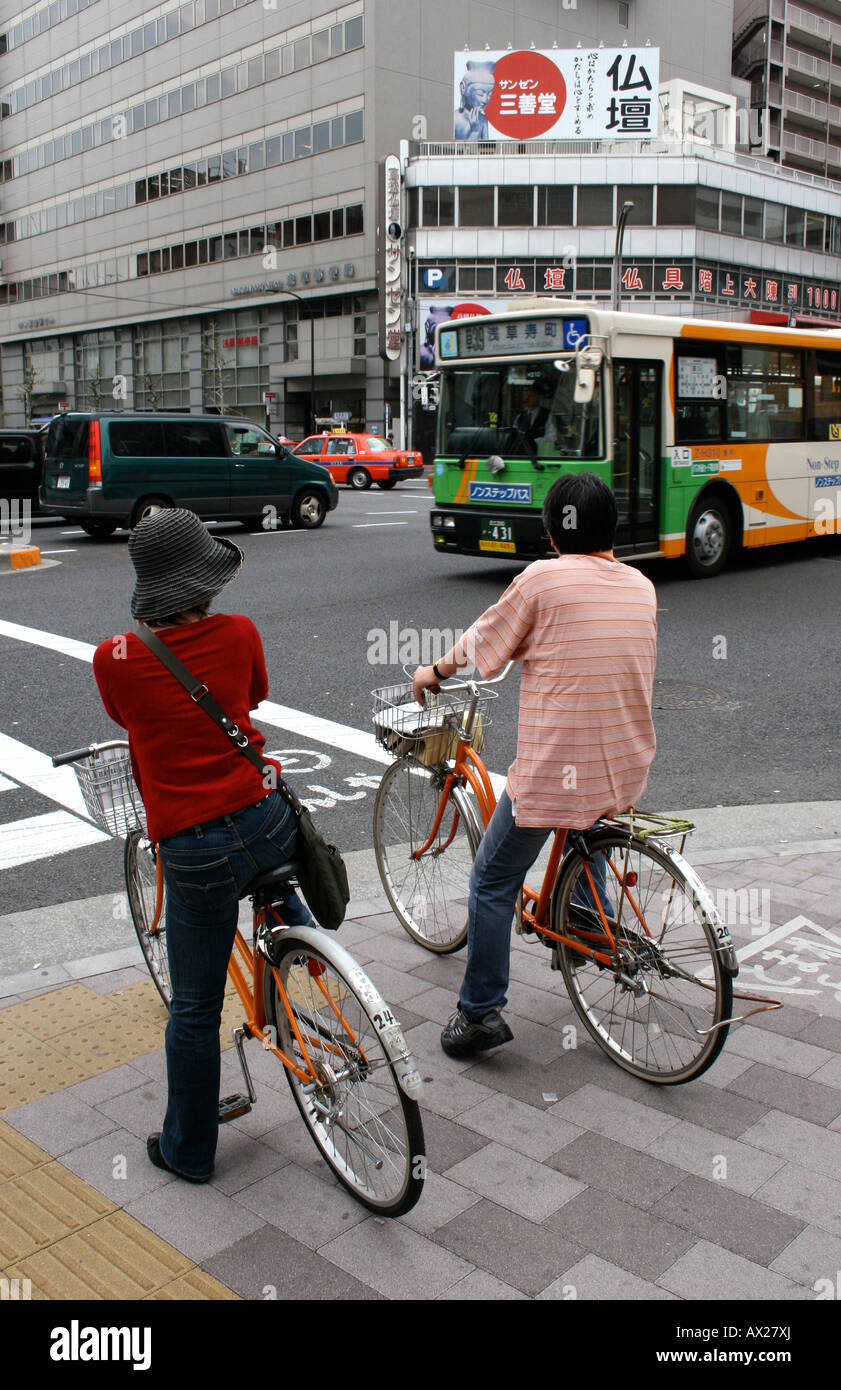 Tokyo, people on bikes Stock Photo - Alamy