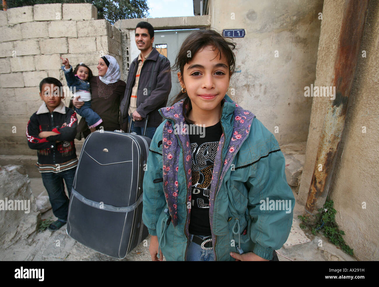 An Iraqi family outside of their home in Amman Many Iraqi refugees have ...