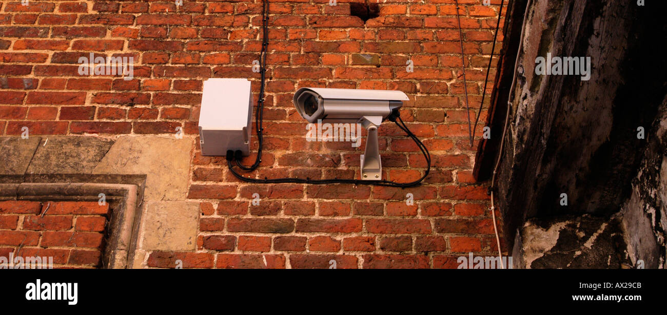 surveillance camera mounted on brick wall Stock Photo - Alamy
