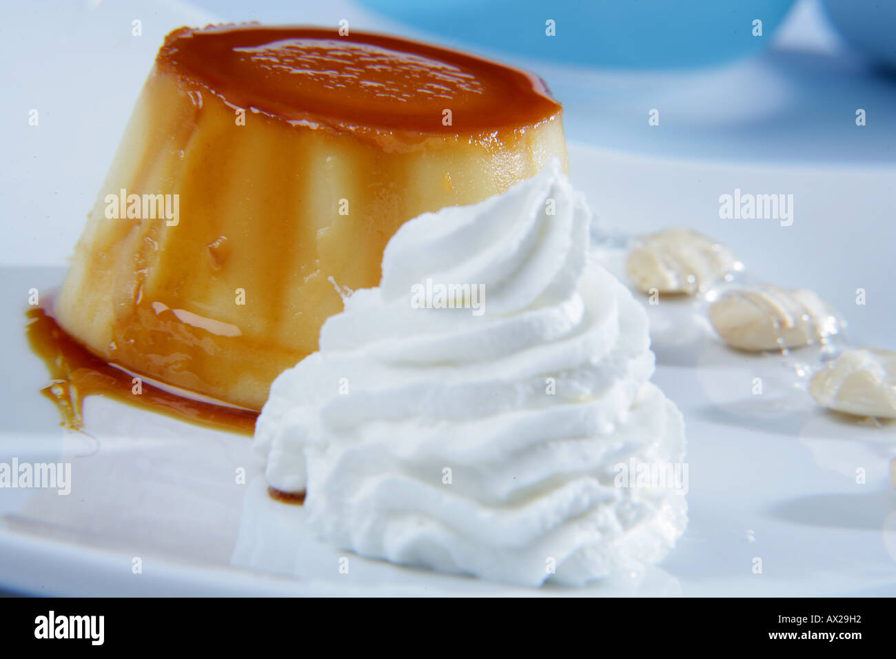 Caramel custard with whipped cream nuts and caramel variations Stock ...