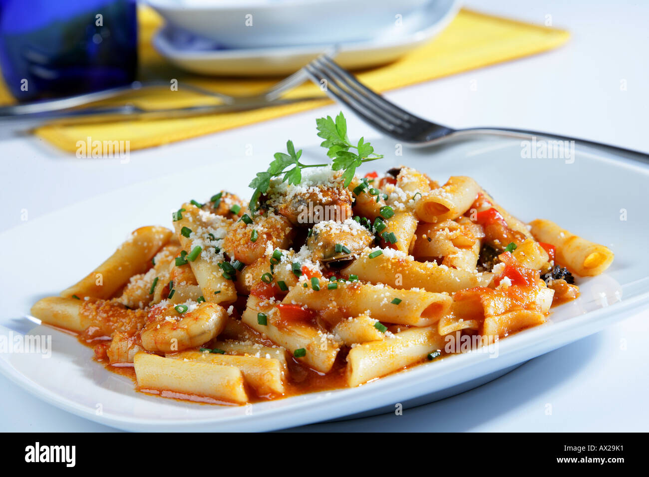 Penne with fish seafood and grated cheese Stock Photo: 9545968 - Alamy
