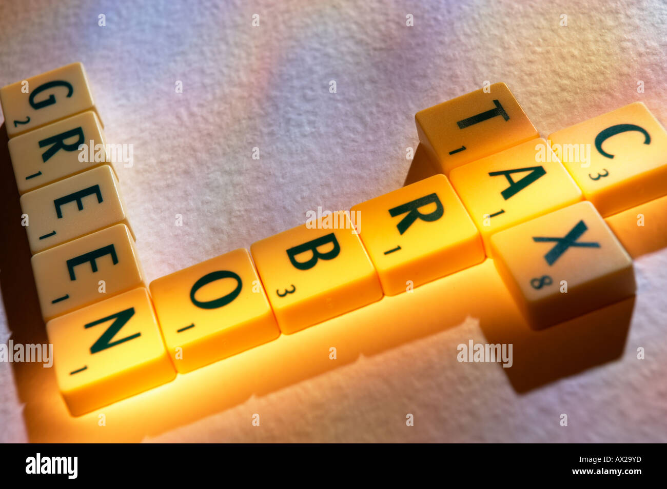 SCRABBLE BOARD GAME LETTERS SPELLING CARBON TAX GREEN Stock Photo - Alamy